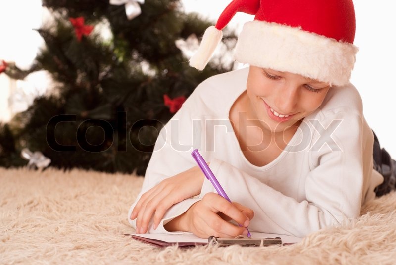 Handsome boy write a letter | Stock image | Colourbox