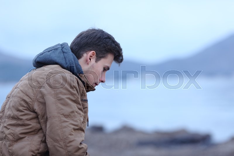 Side view ortrait of a sad man in ... | Stock image | Colourbox
