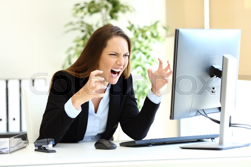 Frustrated Office Worker At Desk