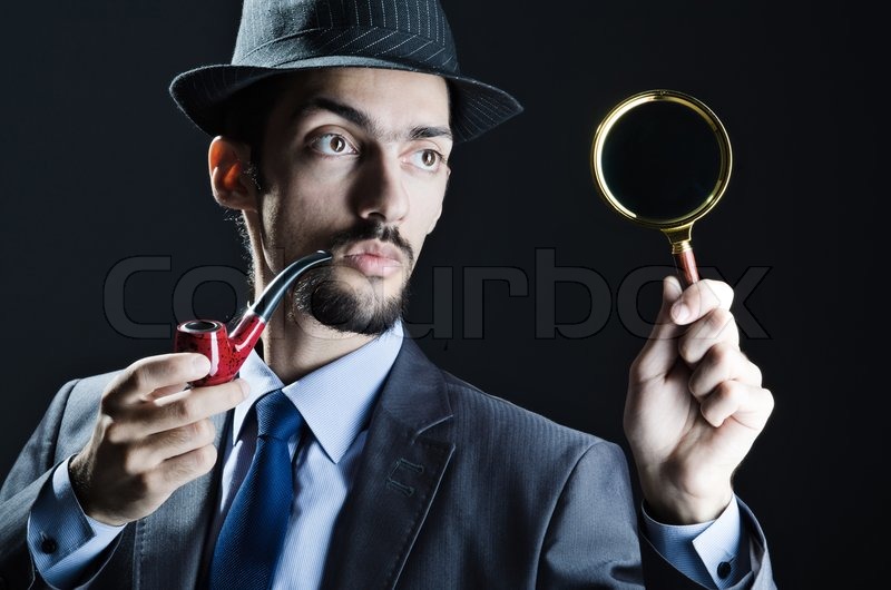 Detective with magnifying glass and ... | Stock image | Colourbox