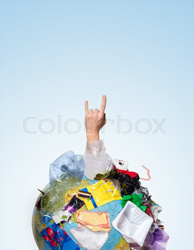 An earth globe covered with trash and ... | Stock image | Colourbox