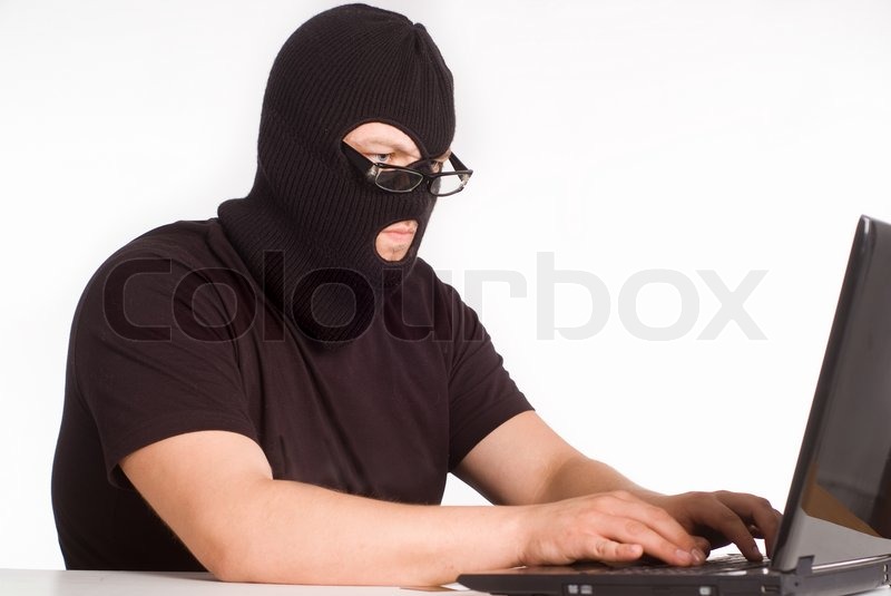 Robber with laptop | Stock image | Colourbox