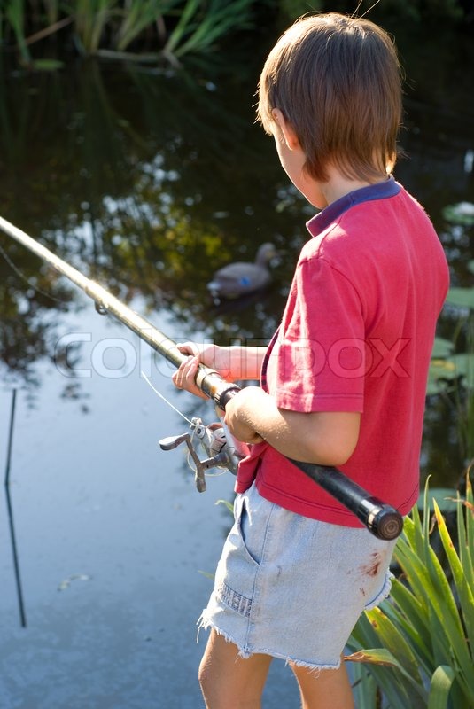 Young boy fishing | Stock Photo | Colourbox