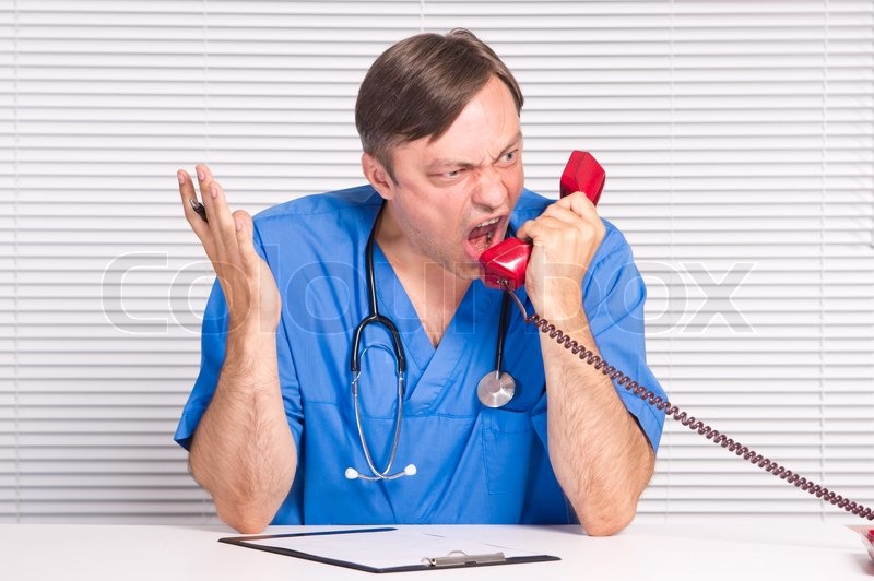 Doctor with telephone | Stock Photo | Colourbox