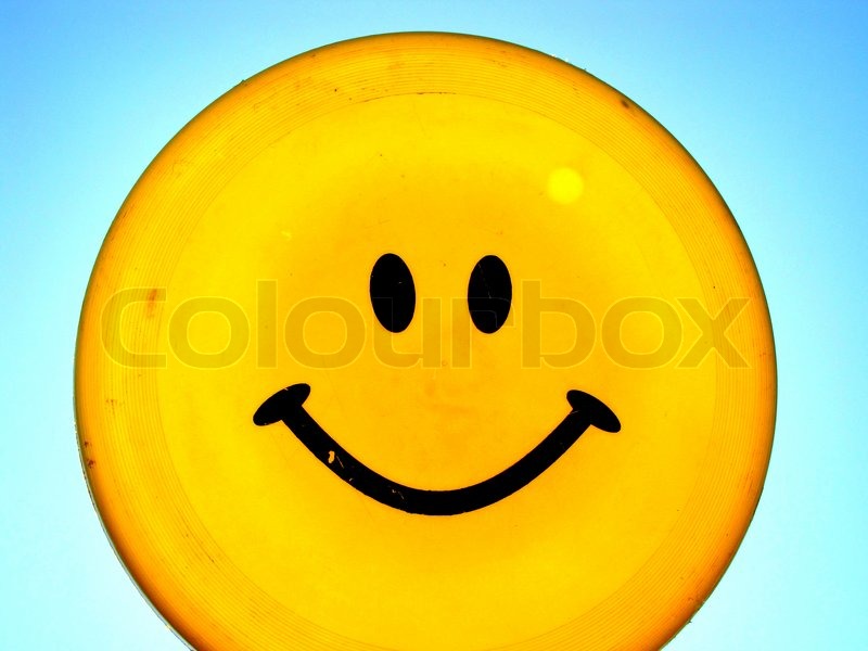 Happy smiley on blue backgroud. Glad, ... | Stock foto | Colourbox