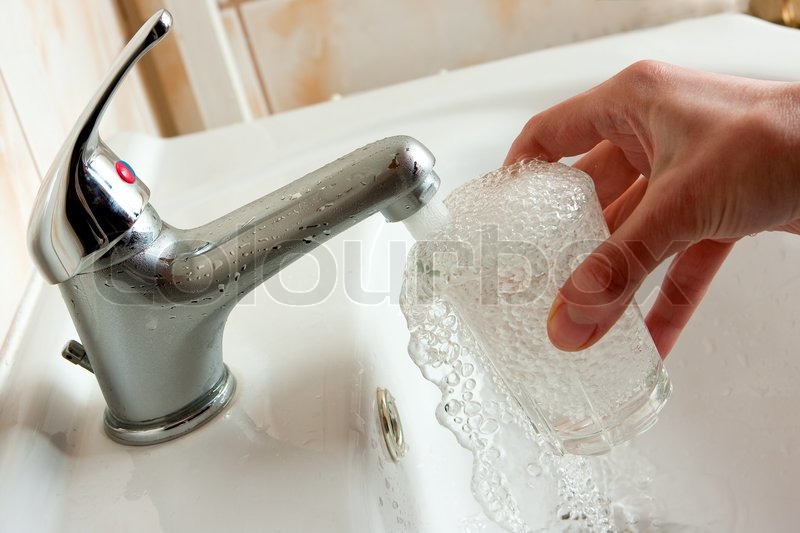 Filling glass of water | Stock image | Colourbox