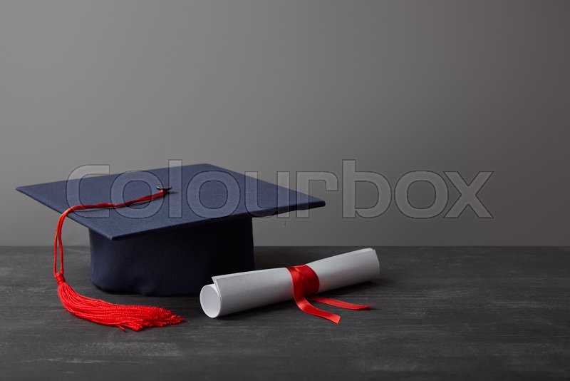 Red Graduation Cap And Diploma