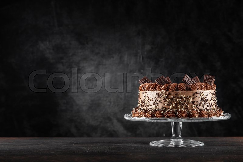 Decorated chocolate cake on dark ... | Stock image | Colourbox