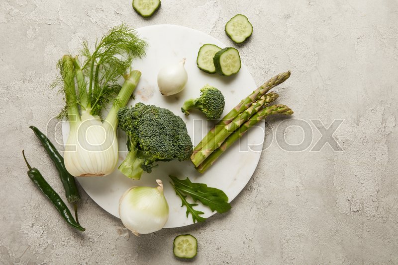 Top view of fresh vegetables on grey ... | Stock image | Colourbox