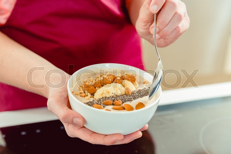 Close-up of woman's hand holding bowl ... | Stock image | Colourbox