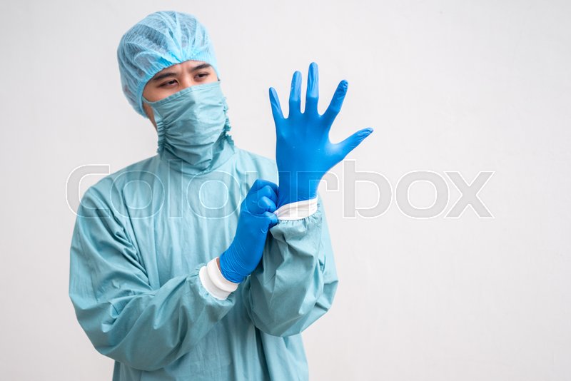 Portrait of a young surgeon over white ... | Stock image | Colourbox