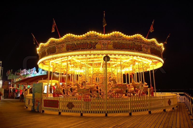 Carousel illuminated at night | Stock image | Colourbox