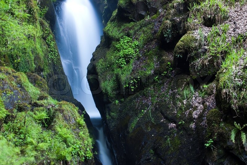 Beautiful cascading waterfall over ... | Stock image | Colourbox