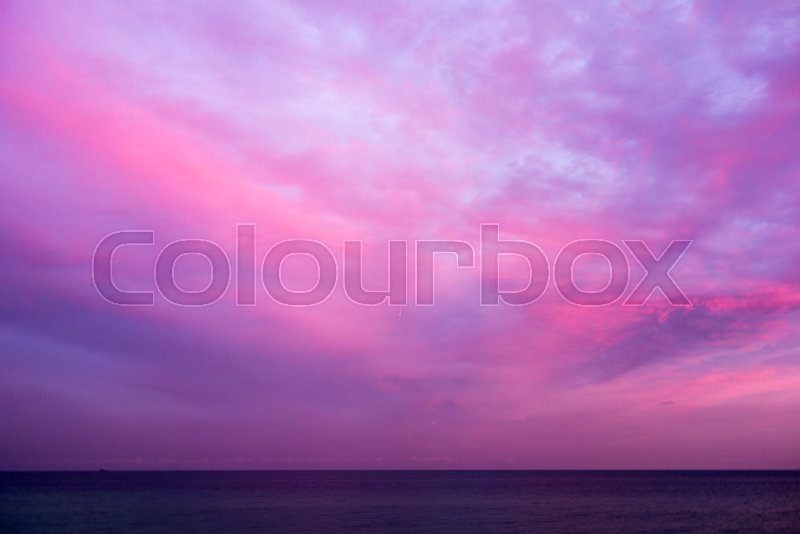 A glowing magenta sunset rises over the ... | Stock image | Colourbox
