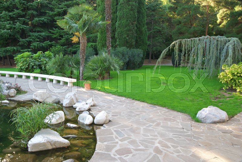 Pathway in garden, Green lawns with ... | Stock image | Colourbox