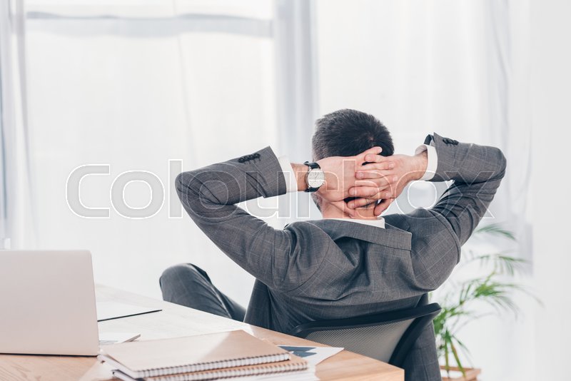 Back view of businessman with Hands ... | Stock image | Colourbox