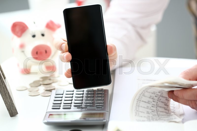 Male hand showing cell phone to camera ... | Stock image | Colourbox
