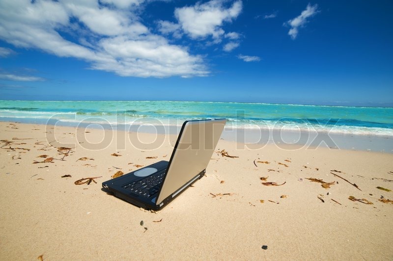 Laptop on the beach | Stock image | Colourbox