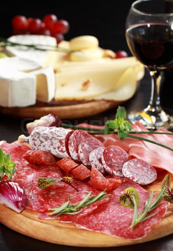 Salami and cheese platter with herbs | Stock image | Colourbox