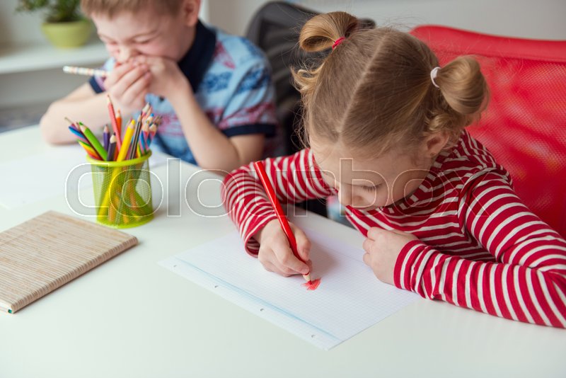Two cute children drawing with colorful ... | Stock image | Colourbox