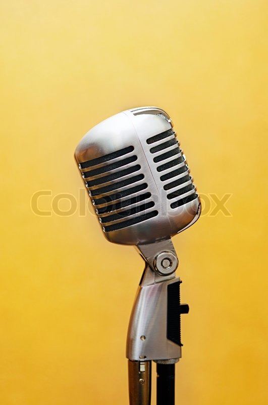 Vocal studio microphone over yellow | Stock image | Colourbox