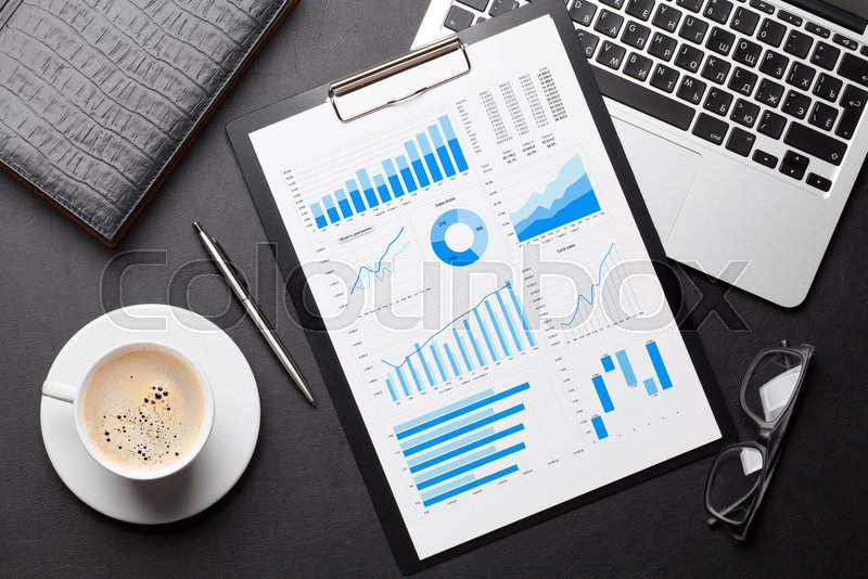 Office workplace table with charts ... | Stock image | Colourbox