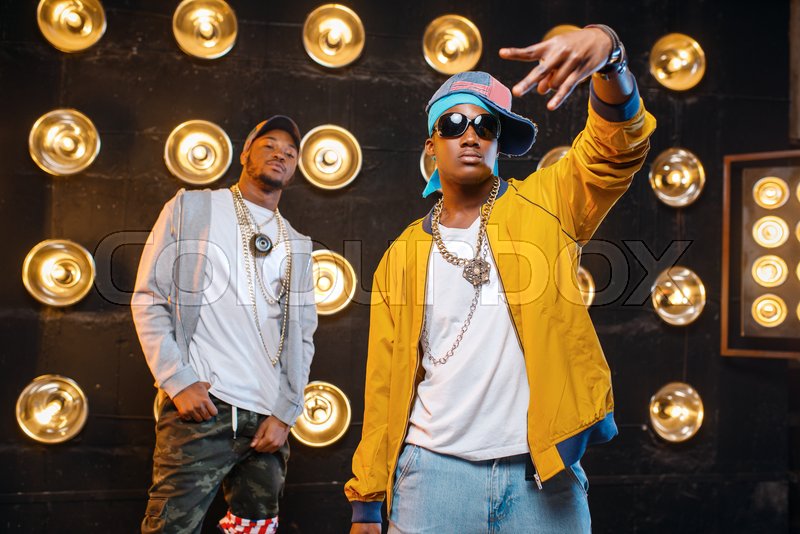 Two black rappers in caps on stage with ... | Stock image | Colourbox
