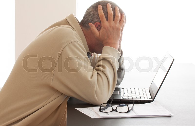 Casual dressed man is bending his head ... | Stock image | Colourbox