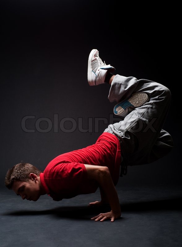 Breakdancer in freeze against dark ... | Stock image | Colourbox