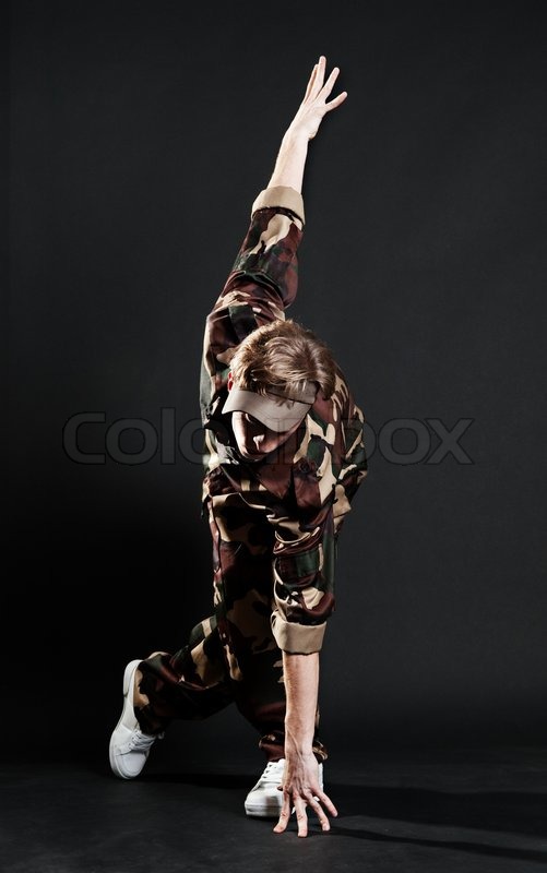 Man in military costume is dancing | Stock image | Colourbox