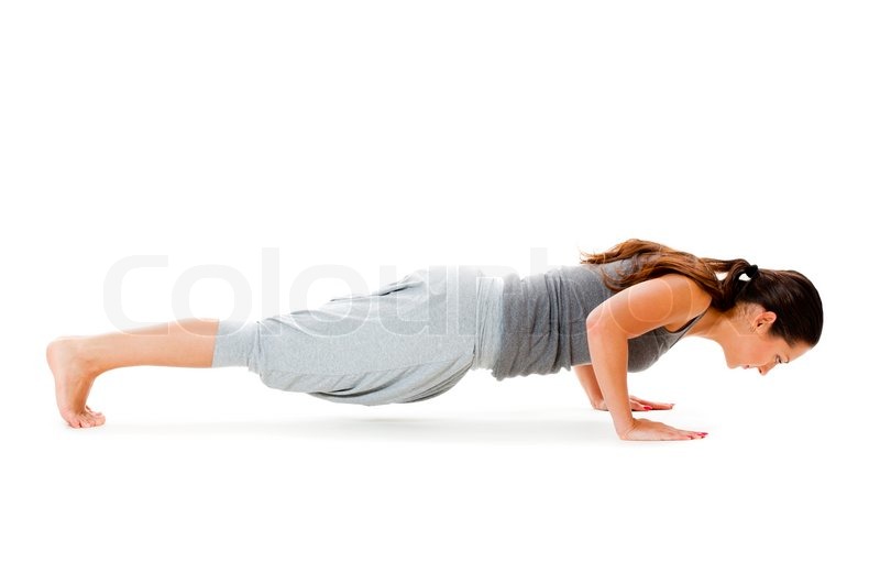 Woman doing push-up exercise | Stock image | Colourbox