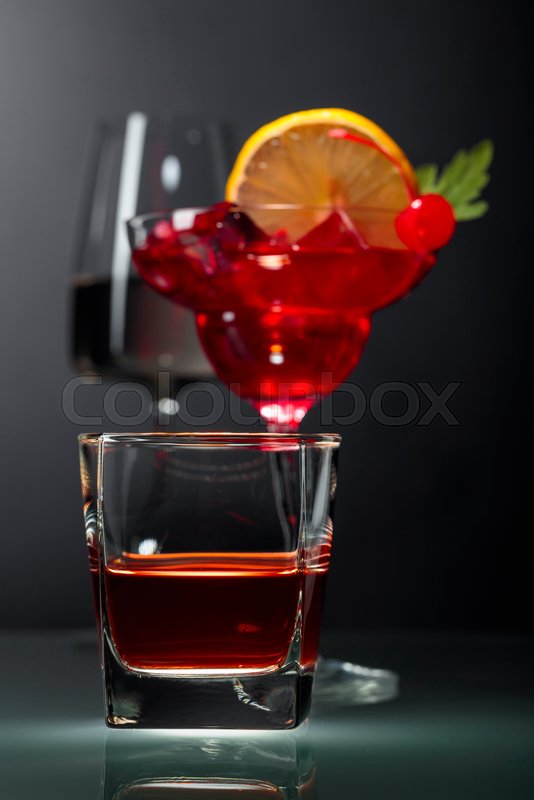 Various alcoholic drinks on a black ... | Stock image | Colourbox