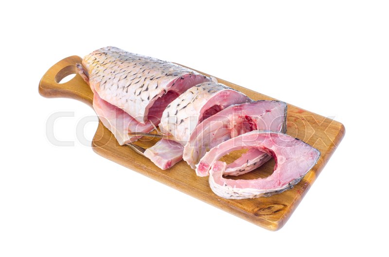 Sliced raw fish on wooden cutting ... | Stock image | Colourbox