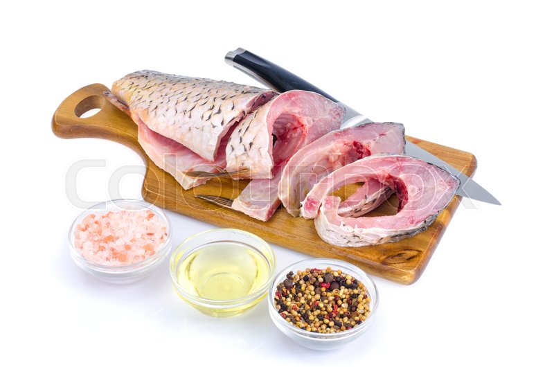 Sliced raw fish on wooden cutting ... | Stock image | Colourbox