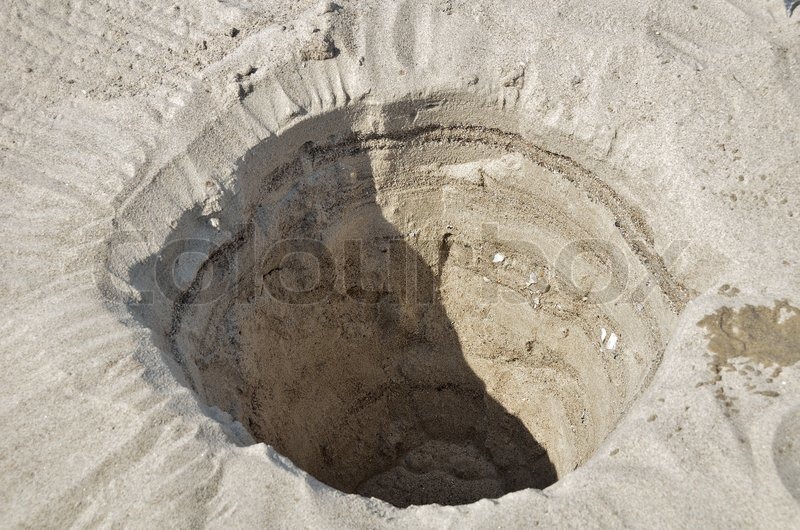 Holes, sand, holes in the beach | Stock Photo | Colourbox
