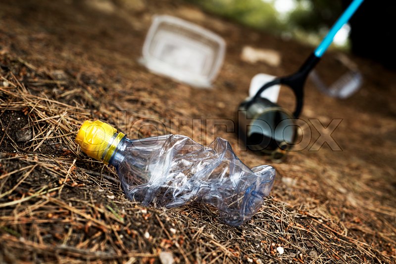 Closeup of someone collecting garbage ... | Stock image | Colourbox