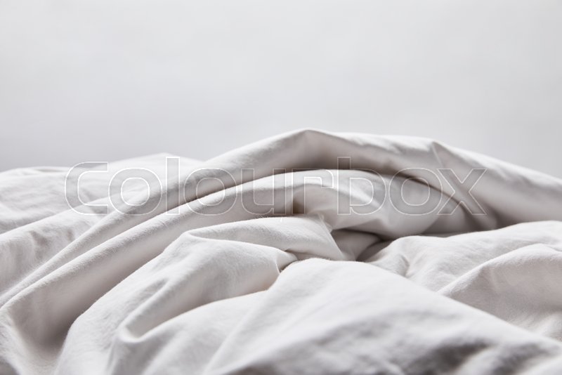 Crumpled white blanket in bed isolated ... | Stock image | Colourbox