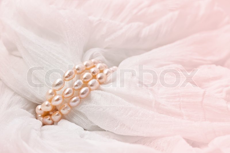 Pink pearls on a Pink background. ... | Stock image | Colourbox