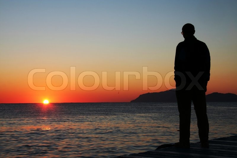 Man looking on sunset | Stock image | Colourbox