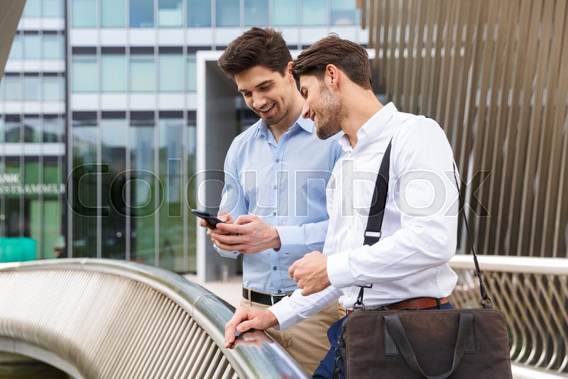 Two People Standing Talking