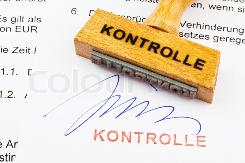 Wood stamp on the document: control | Stock image | Colourbox
