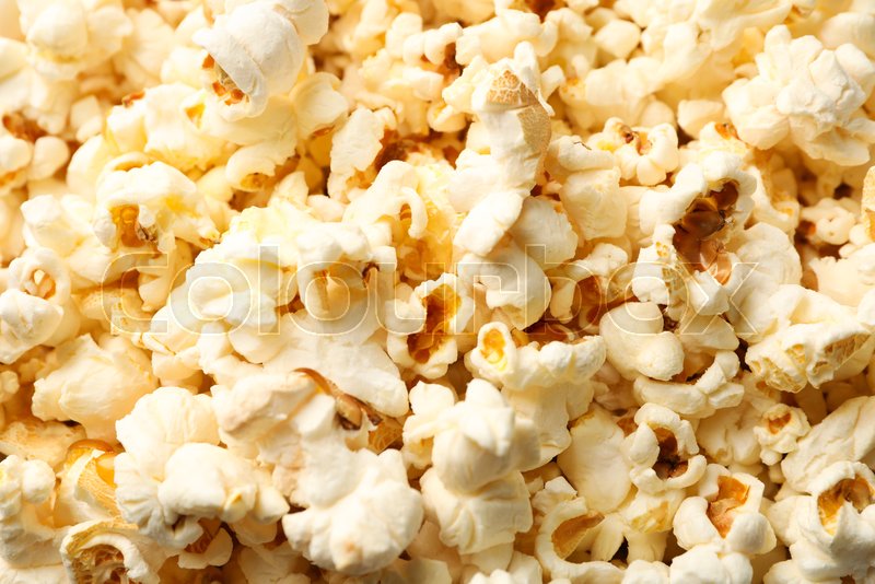 Delicious popcorn on whole background, ... | Stock image | Colourbox