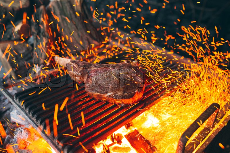 Beef steak is cooked on fire. Beef Rib ... | Stock image | Colourbox