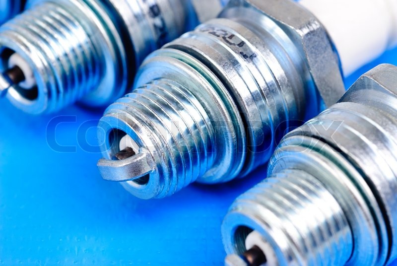 Spark-plug on the blue background | Stock image | Colourbox