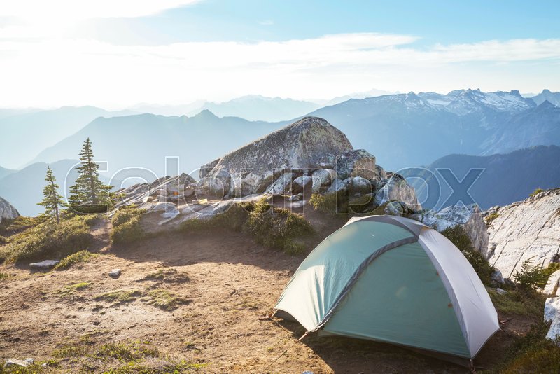 Tent in the summer mountains. Hiking ... | Stock image | Colourbox