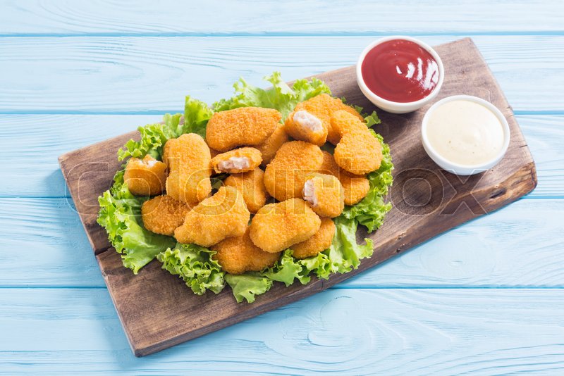 Chicken golden nuggets in plate on ... | Stock image | Colourbox