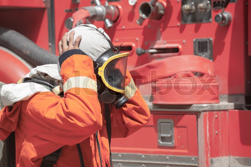 Firefighter wearing mask safety suite ... | Stock image | Colourbox