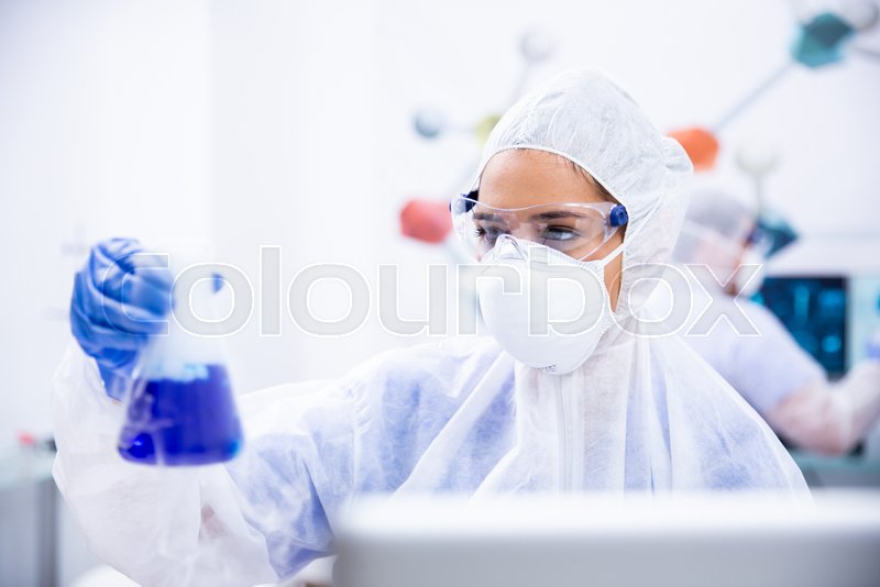 Chemist in goggles and gloves mask ... | Stock image | Colourbox