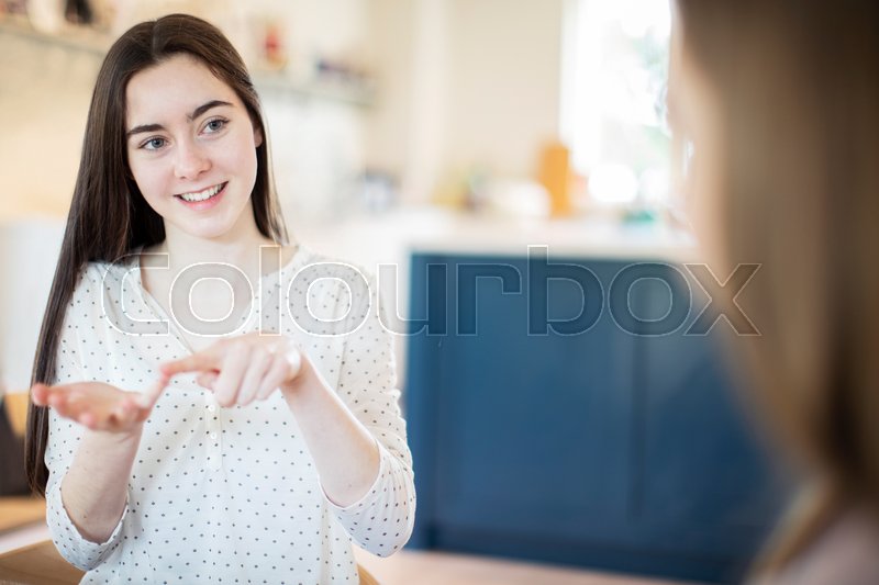 Two Teenage Girls Having Conversation ... | Stock image | Colourbox