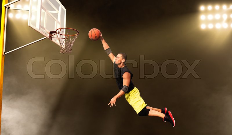 Basketball player makes a throw, shoot ... | Stock image | Colourbox